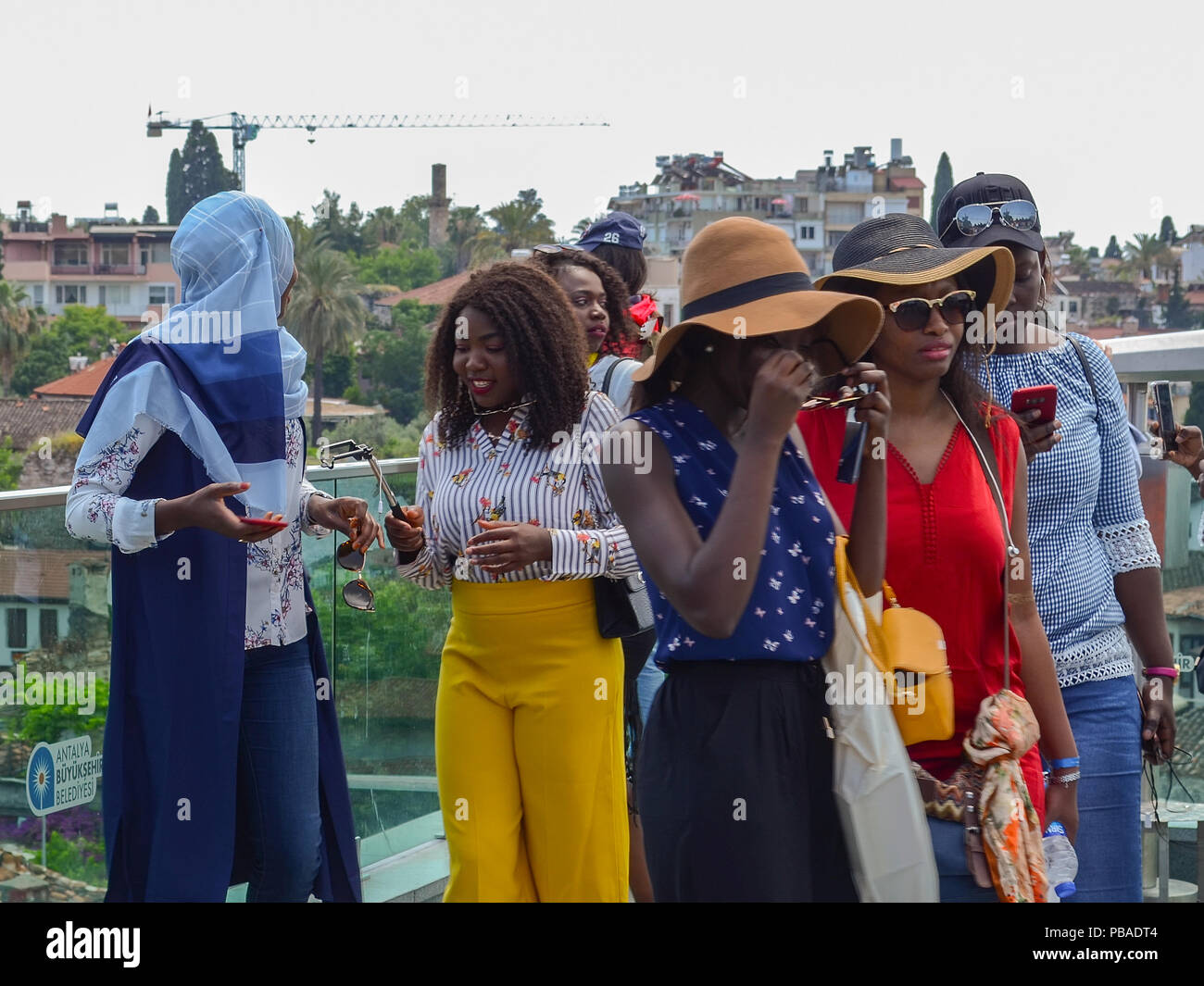 Turkey, Antalya, May 10, 2018. Group of young African women in bright ...