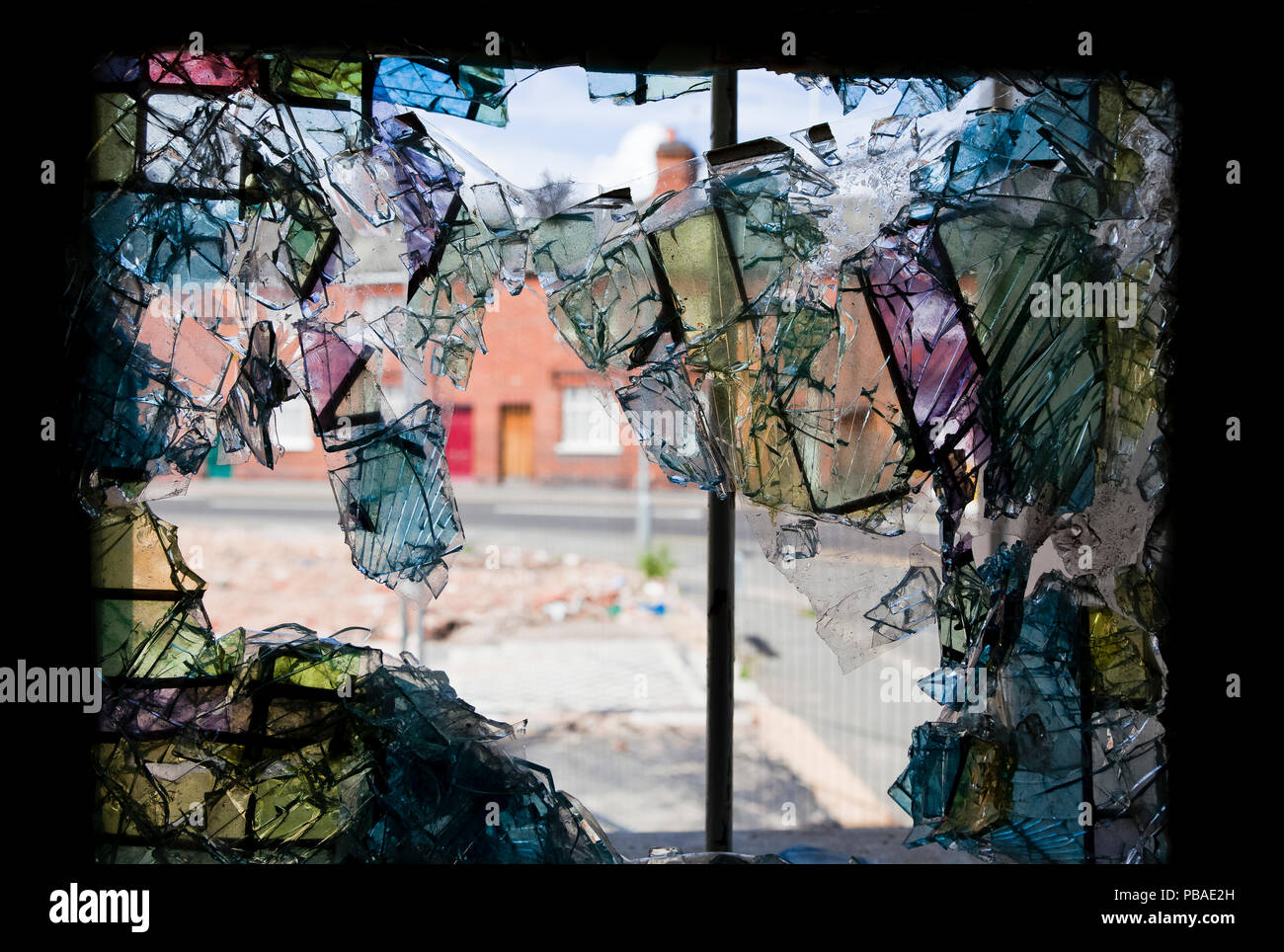 Broken window in part demolished building on the corner of Pinfold Gate ...