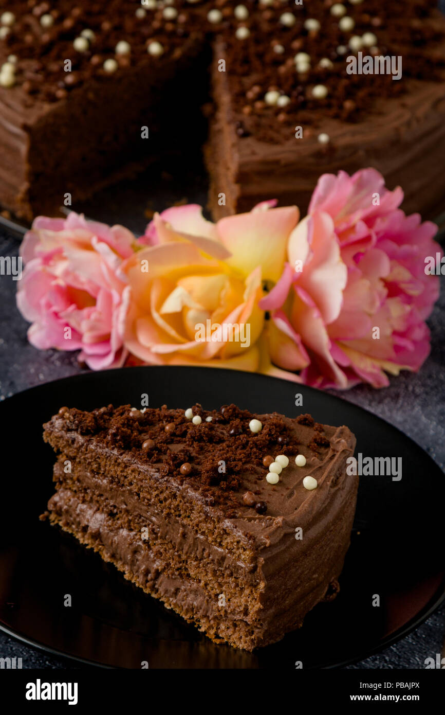 Sweet dark brown chocolate cake with decoration Stock Photo - Alamy