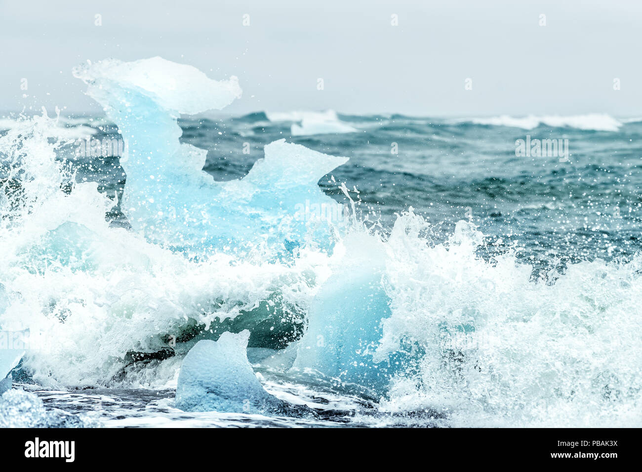Waves crashing on Jokulsarlon Diamond Ice glacial beach in Iceland ...