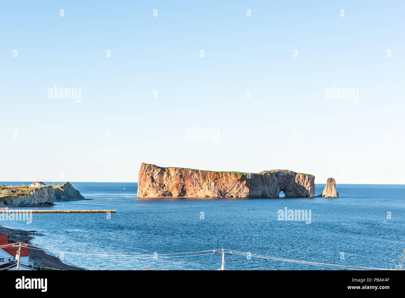 Rocher perce perce rock at sunset village of perce hi-res stock ...