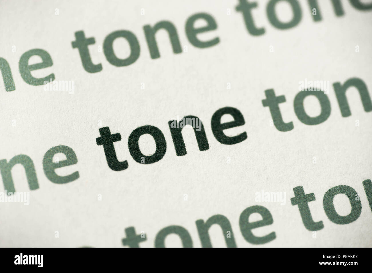 word tone printed on white paper macro Stock Photo - Alamy
