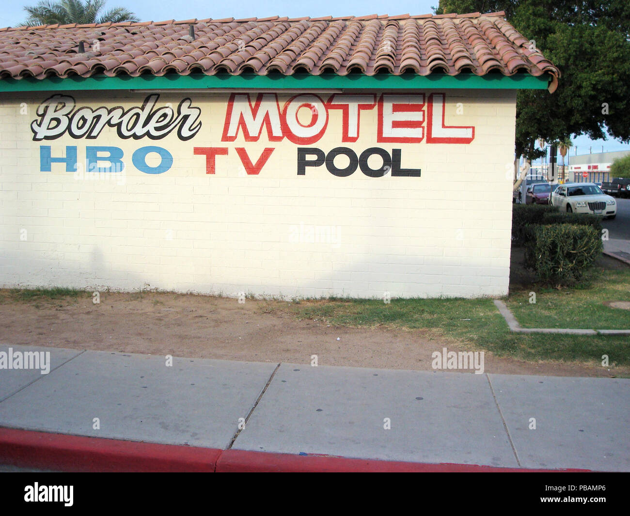 Border Motel wall (HBO, TV, pool) with terracotta roof shingles in ...