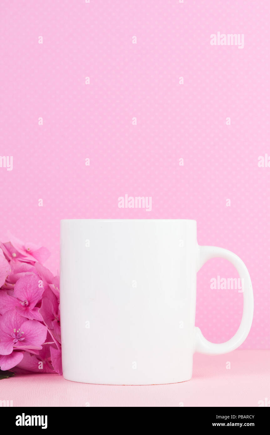 blank white coffee mug mock up with pink flowers Stock Photo - Alamy