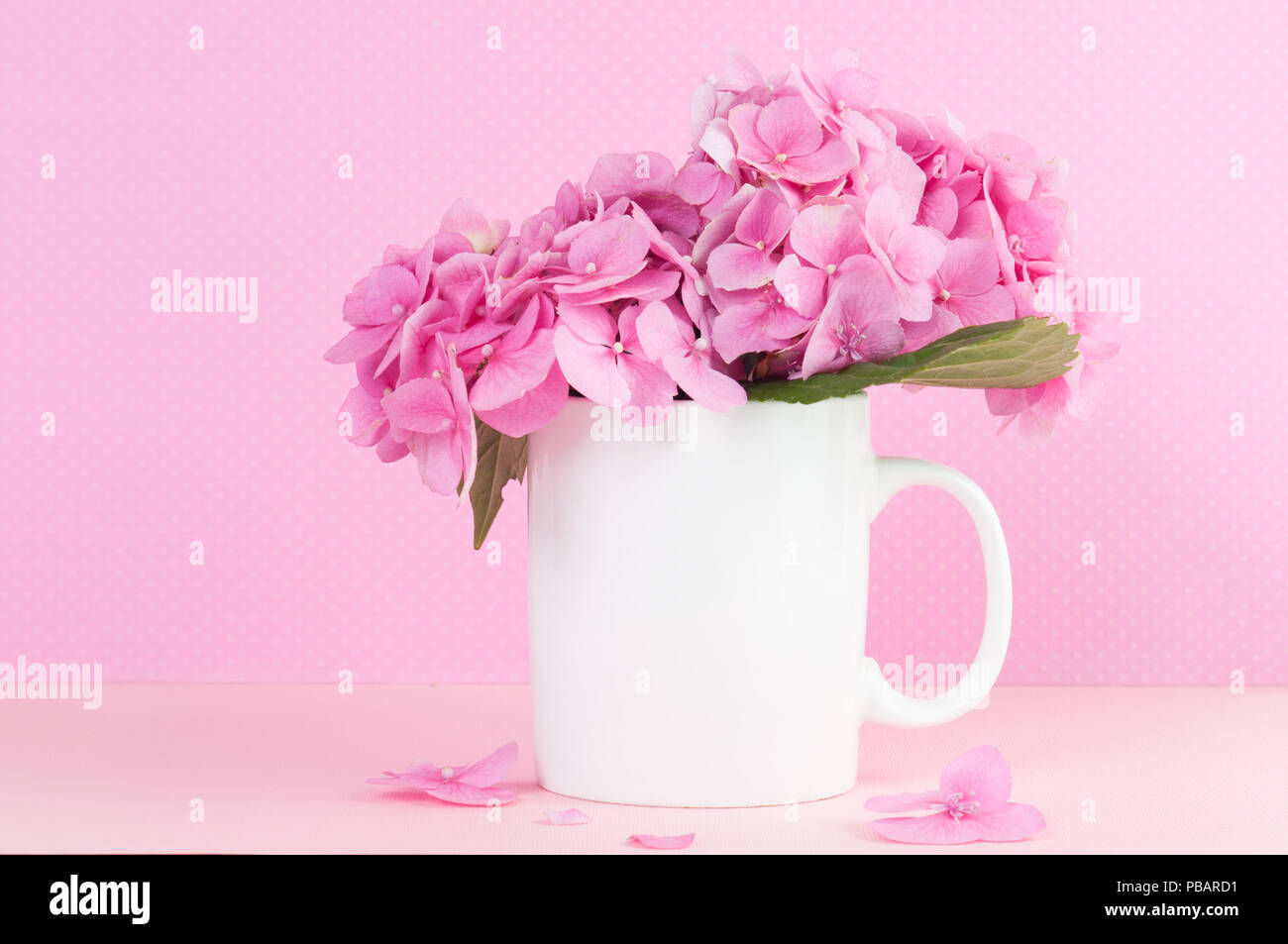 blank white coffee mug mock up with pink flowers Stock Photo - Alamy