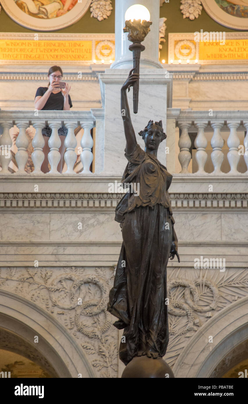 Bronze classical figure holds a "torch of knowledge" In the Great Hall ...