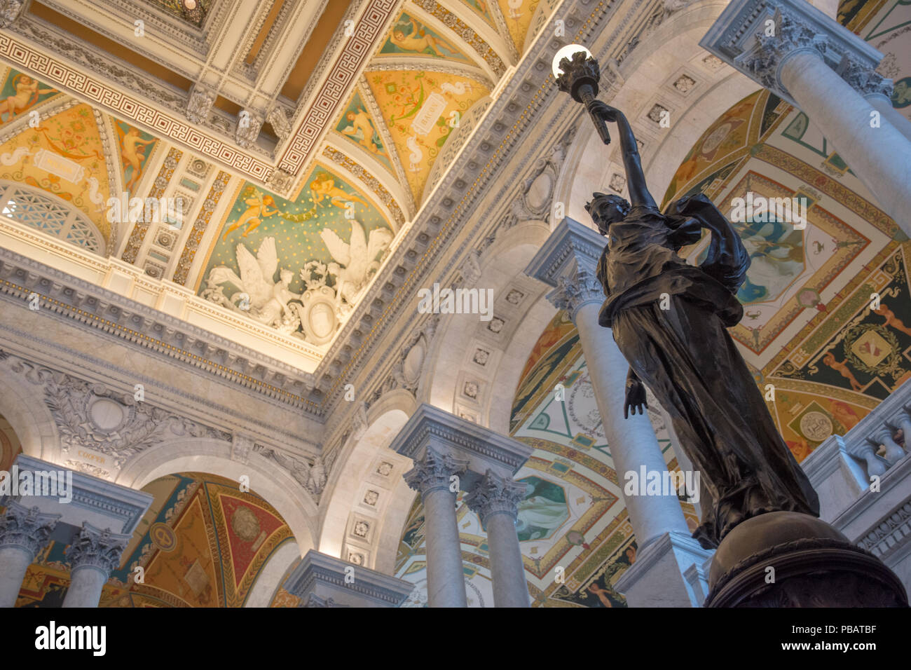 Bronze classical figure holds a "torch of knowledge" In the Great Hall ...