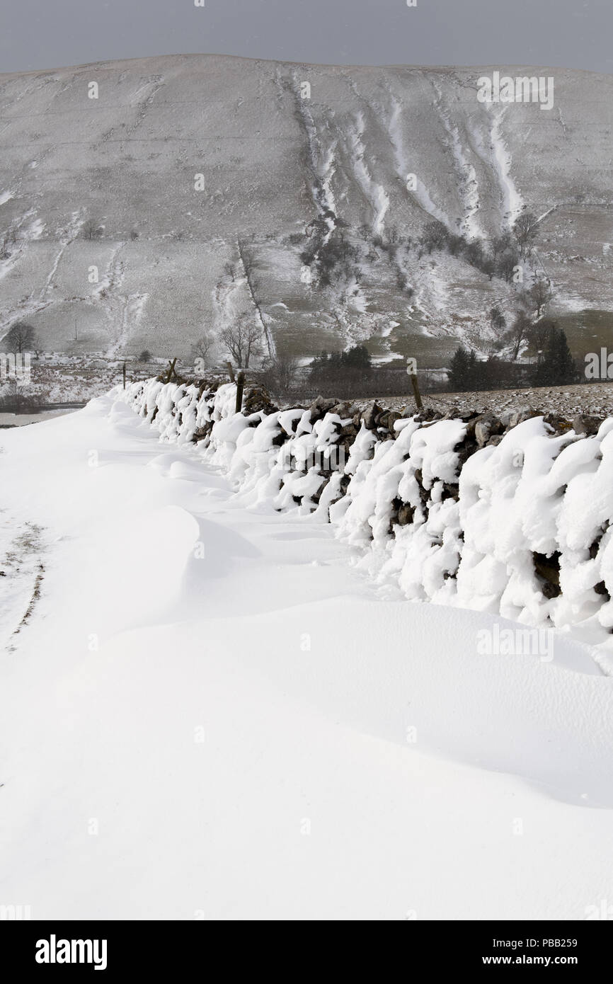 Snow drifts formed at the back of dystone walls after a snow storm in ...