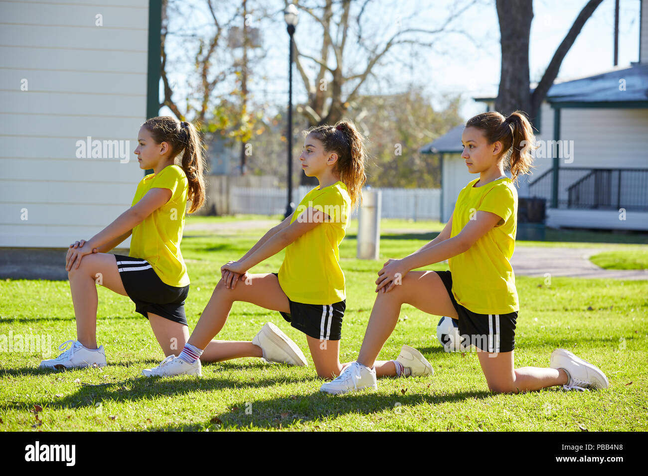 Teen girls group exercise workout at park Stock Photo - Alamy