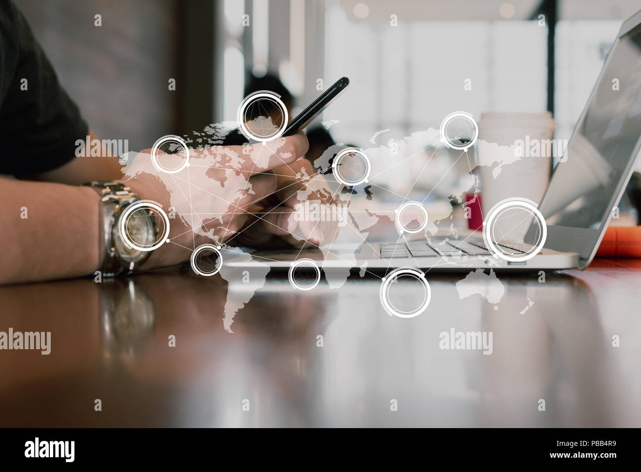 Hand of man use smartphone and laptop with technology of globalization ...