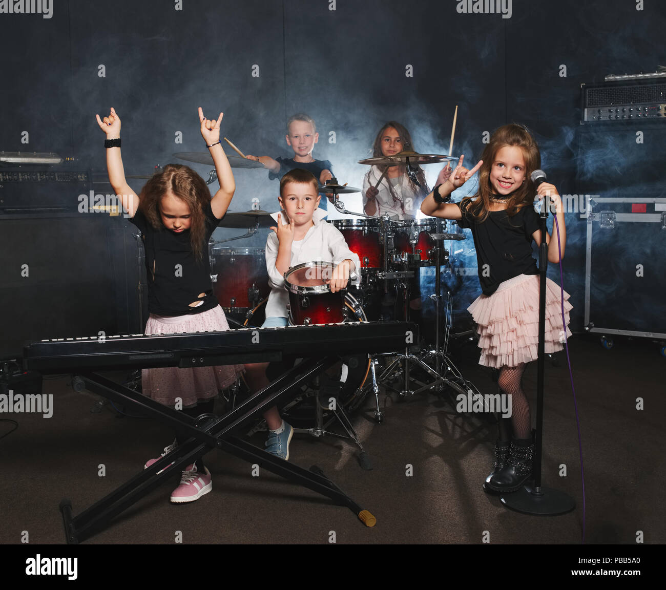 happy children singing and playing music in studio Stock Photo - Alamy