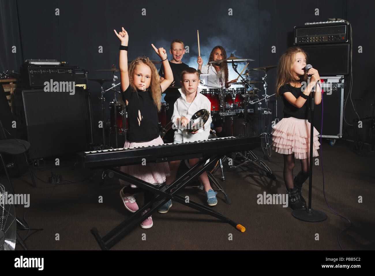 happy children singing and playing music in studio Stock Photo - Alamy