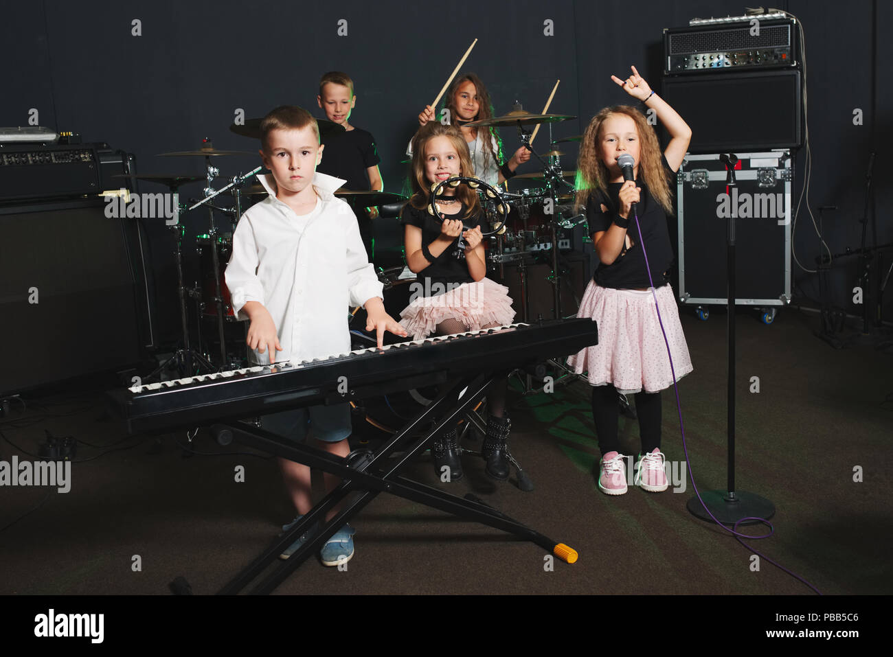 happy children singing and playing music in studio Stock Photo - Alamy