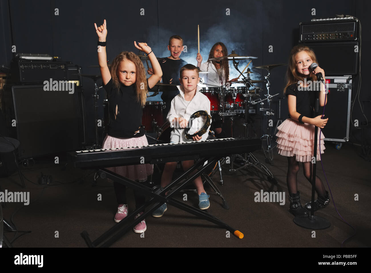 happy children singing and playing music in studio Stock Photo - Alamy