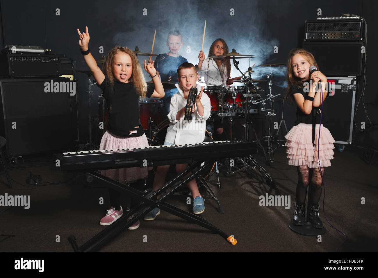 happy children singing and playing music in studio Stock Photo - Alamy