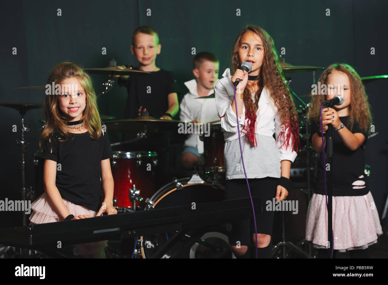 happy children singing and playing music in studio Stock Photo - Alamy