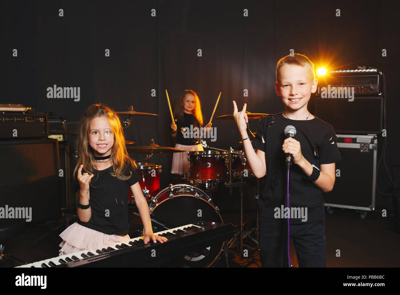 happy children singing and playing music in studio Stock Photo - Alamy