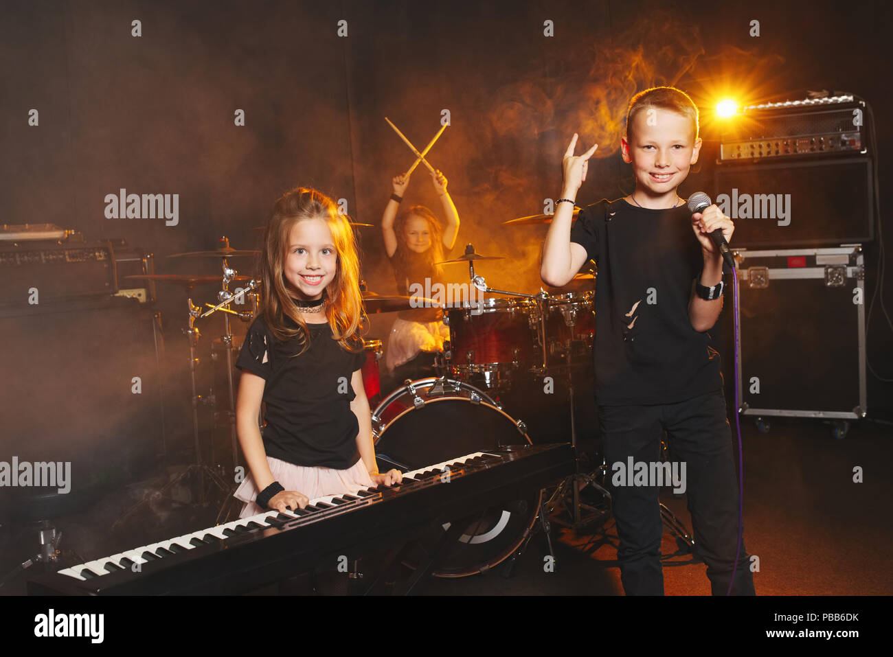 happy children singing and playing music in studio Stock Photo - Alamy
