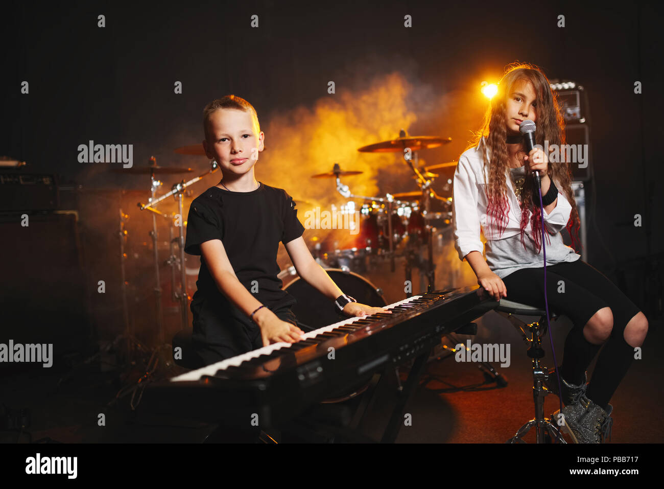 happy children singing and playing music in recording studio Stock ...