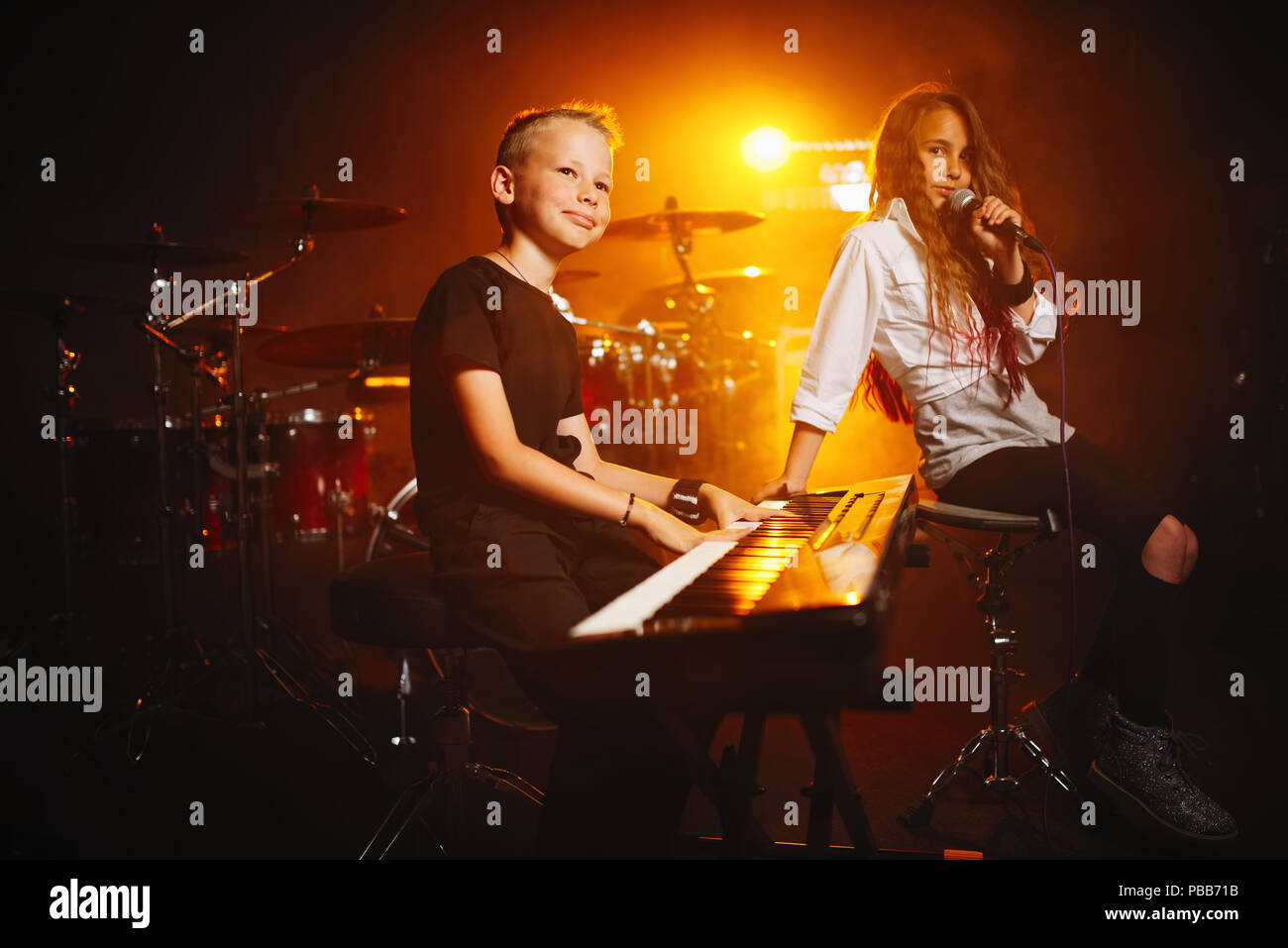 happy children singing and playing music in recording studio Stock ...