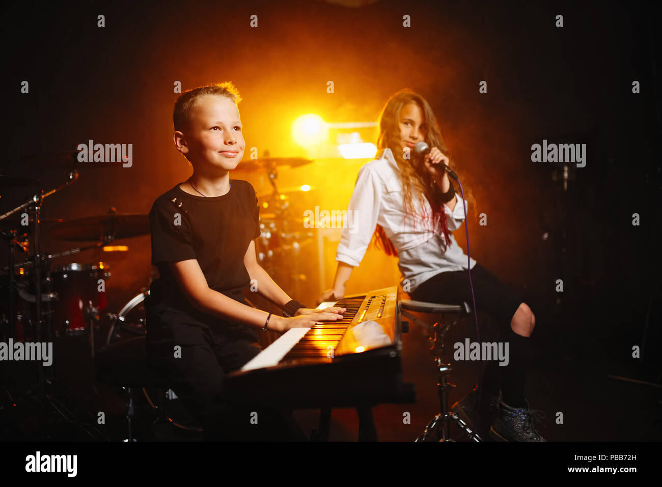 happy children singing and playing music in recording studio Stock ...