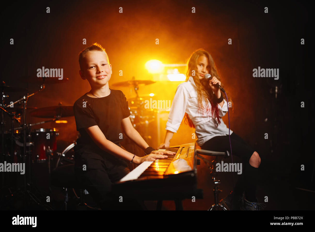 happy children singing and playing music in recording studio Stock ...
