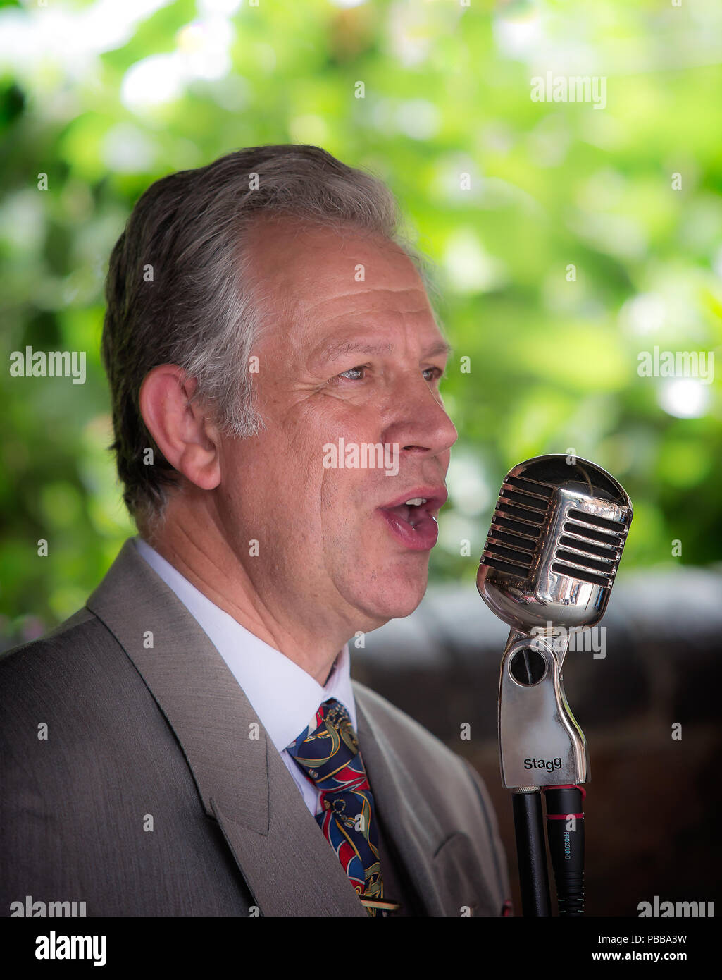 Close-up portrait of singer Kevin McCracken (Kevin Mack) behind vintage ...