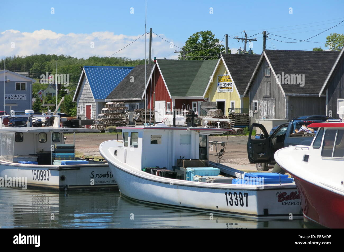 View of the fishing boats and harbour at North Rustico, a popular ...