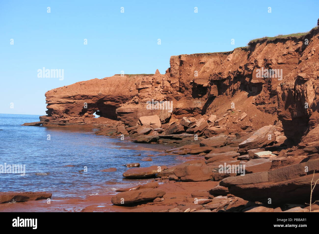 Spectacular red sandstone cliffs are a scenic and popular beauty spot ...