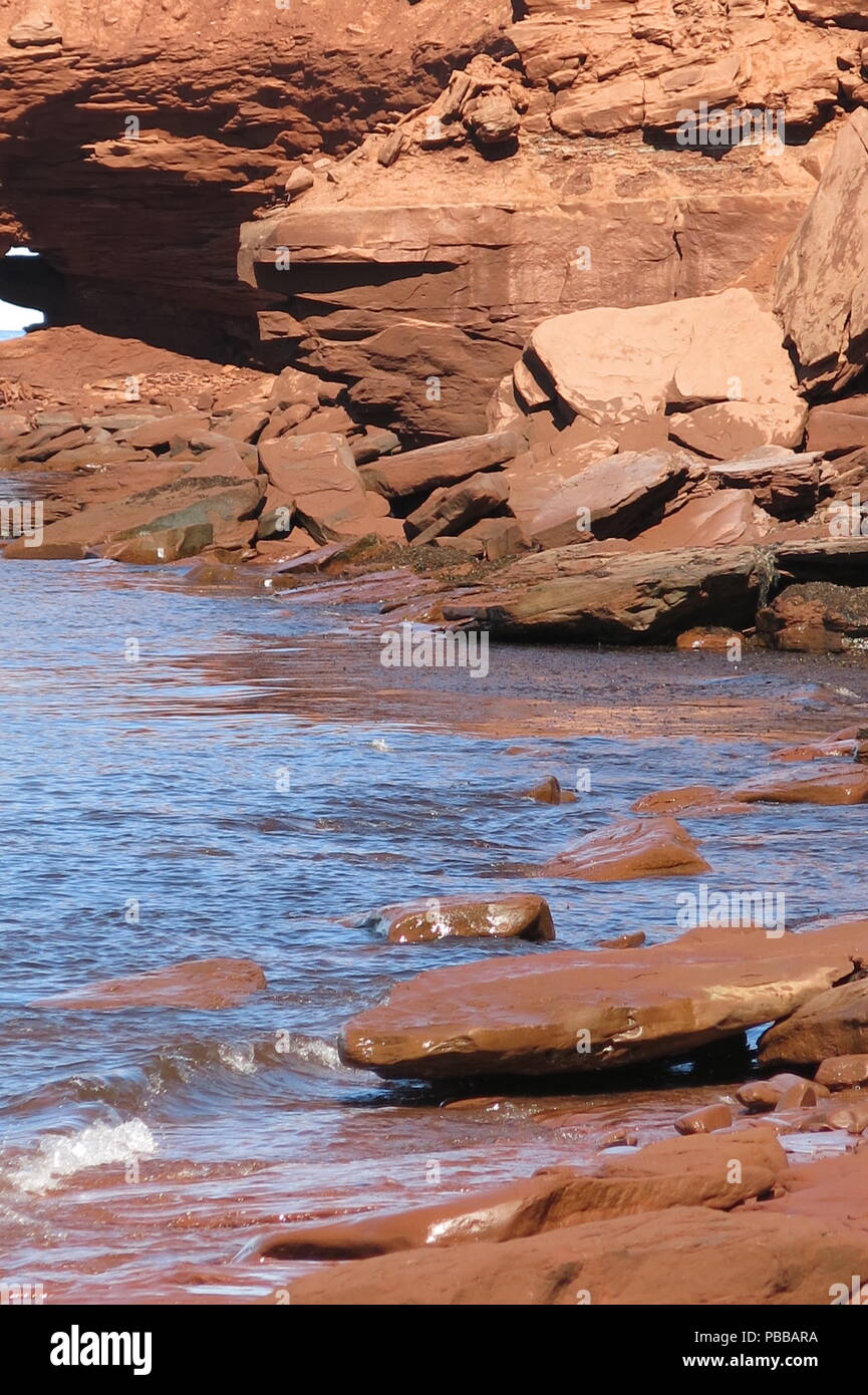 Spectacular red sandstone cliffs are a scenic and popular beauty spot ...