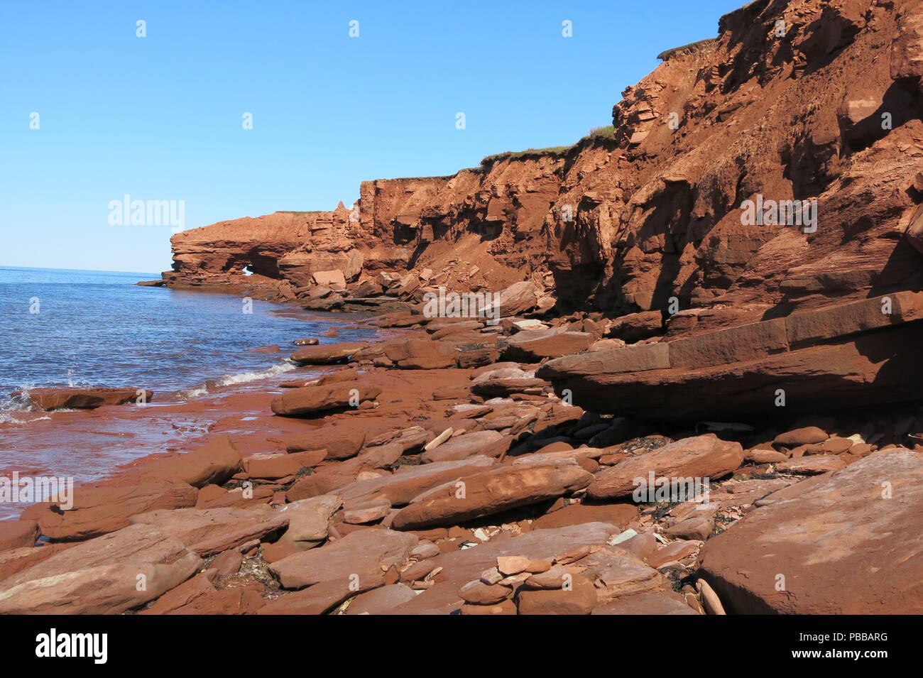 Spectacular red sandstone cliffs are a scenic and popular beauty spot ...