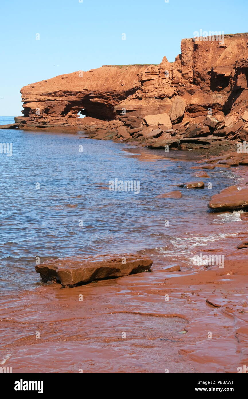 Spectacular red sandstone cliffs are a scenic and popular beauty spot ...