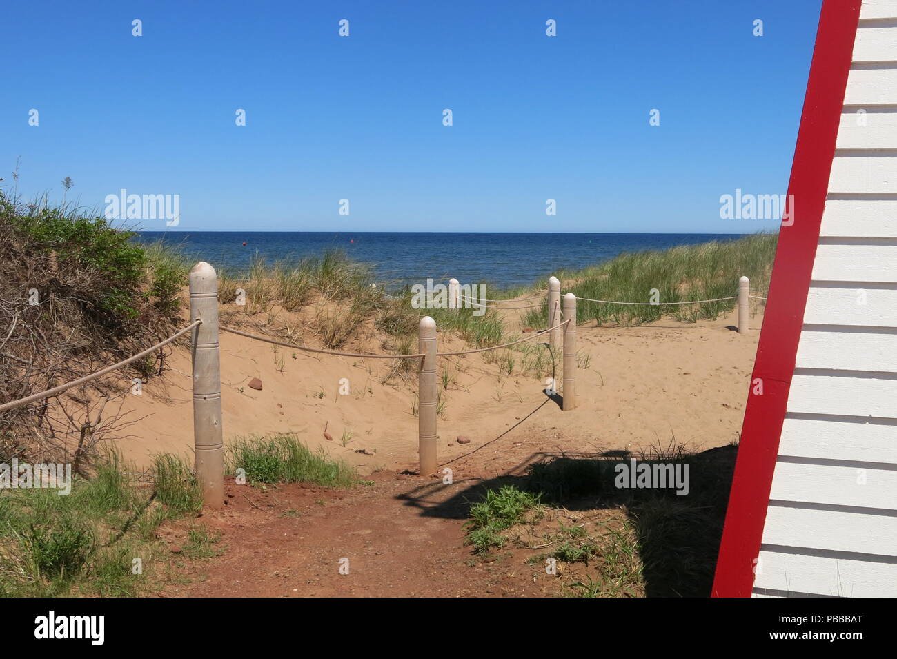 The red & white, square, wooden lighthouse at Covehead Harbour is a ...