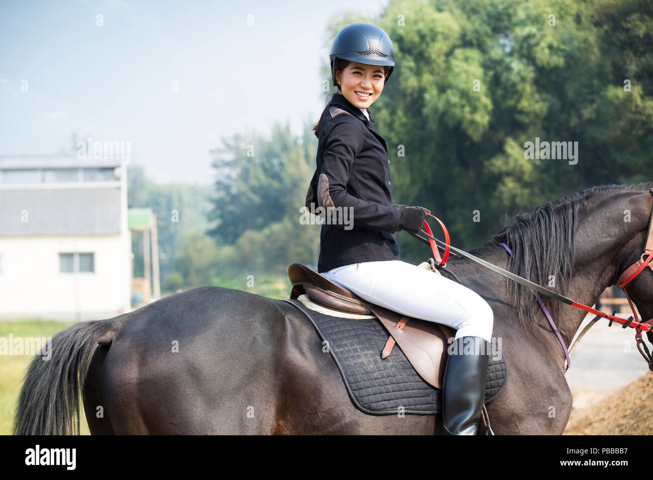 Chinese young woman riding horse hi-res stock photography and images ...