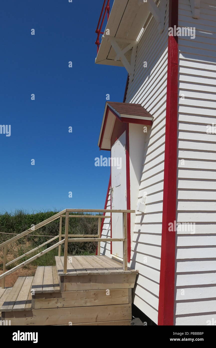 The red & white, square, wooden lighthouse at Covehead Harbour is a ...
