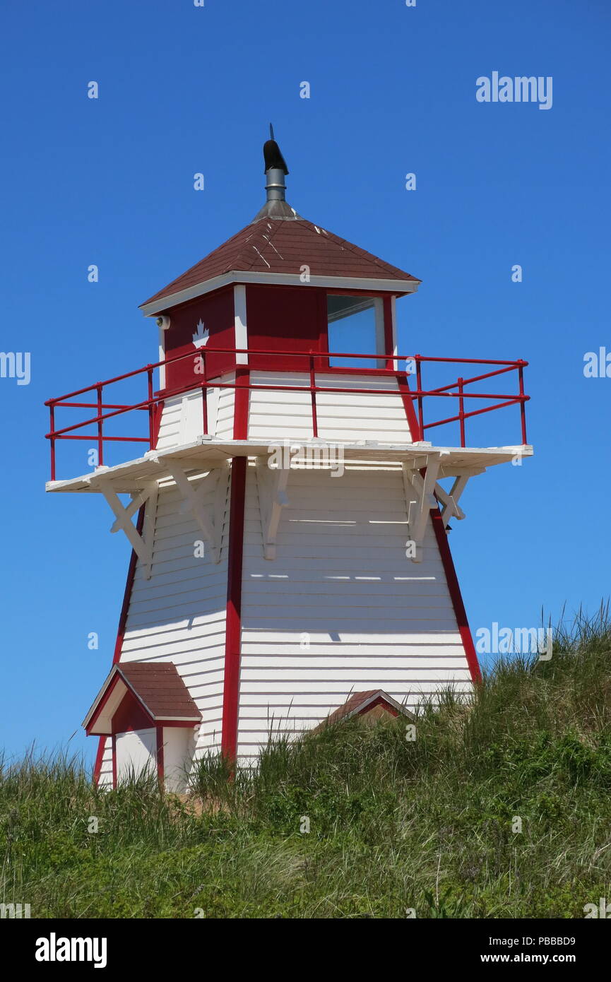 The red & white, square, wooden lighthouse at Covehead Harbour is a ...