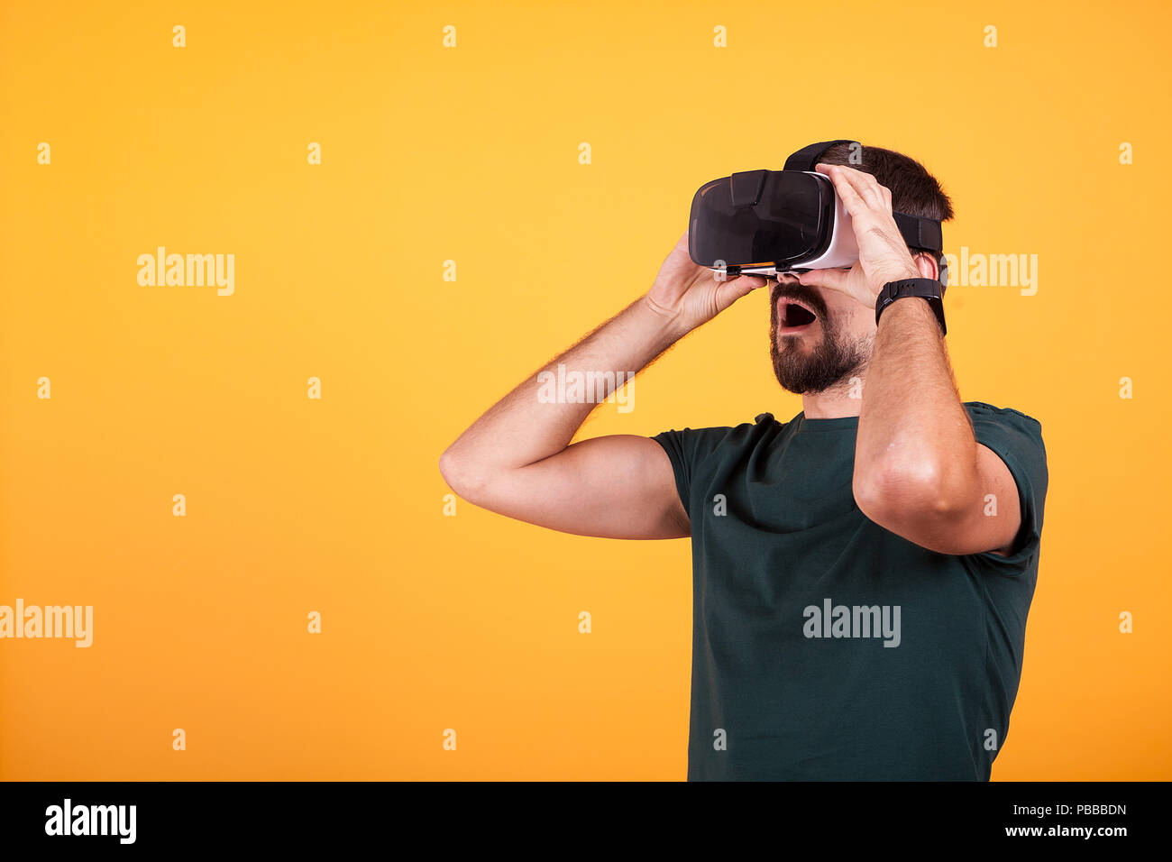 Man wearing VR virtual reality headset is amazed. Modern technology ...