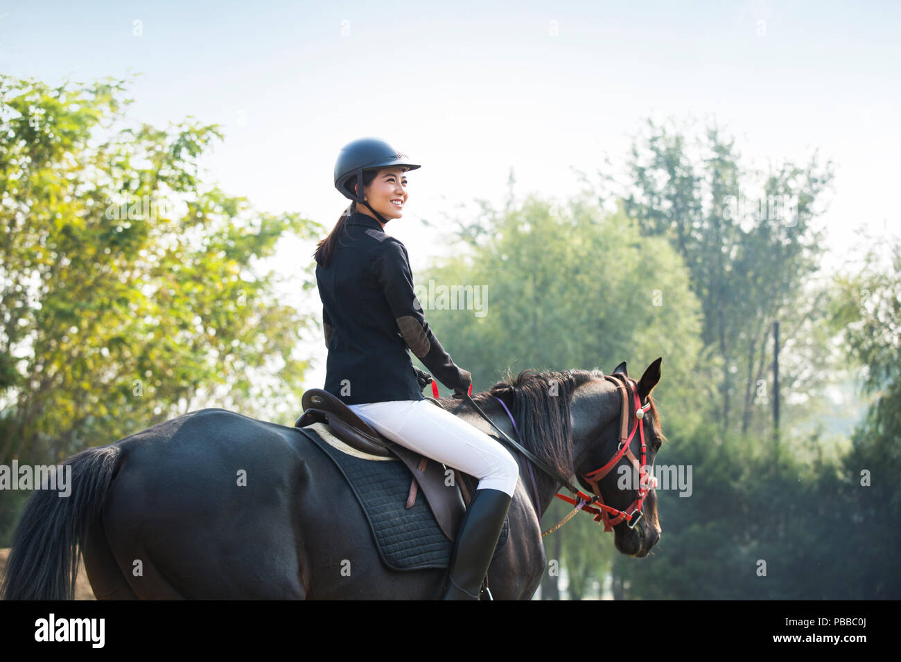 Chinese young woman riding horse hi-res stock photography and images ...