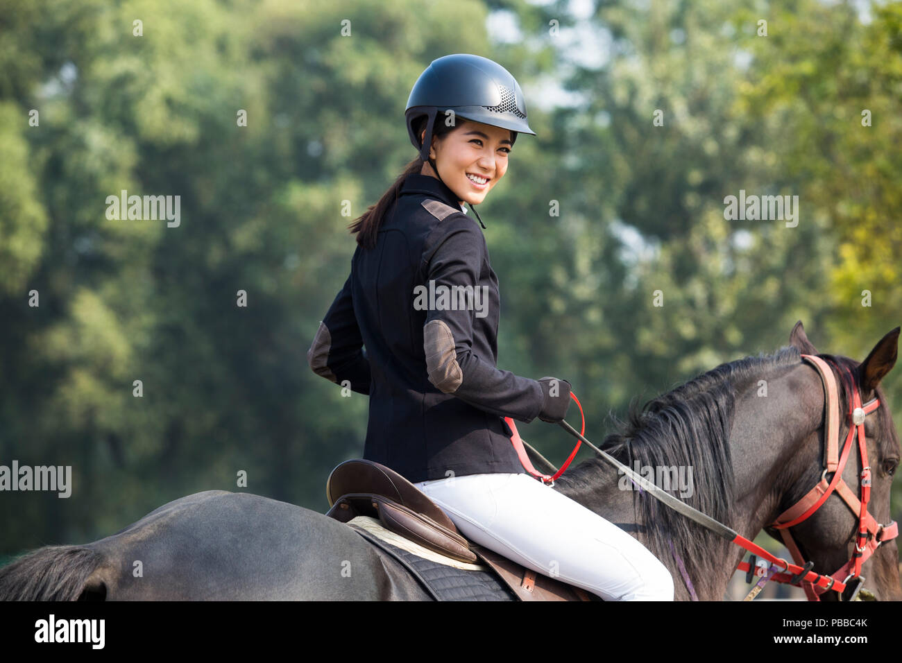 Chinese young woman riding horse hi-res stock photography and images ...