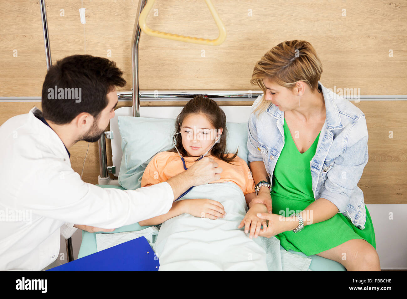 Doctor checking her patient heart in hospital Stock Photo - Alamy