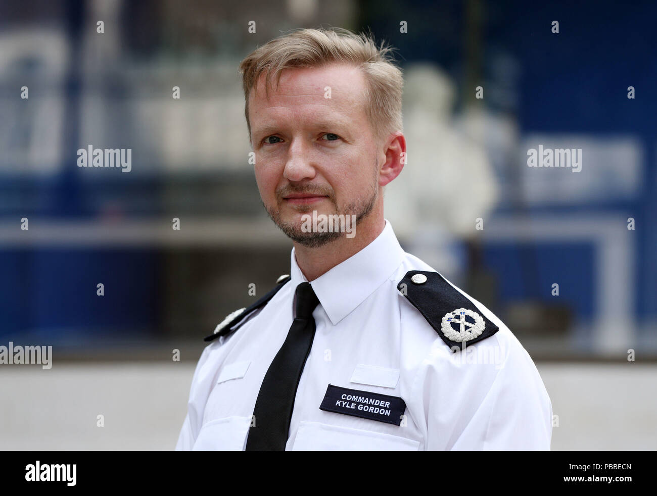 Commander Kyle Gordon speaking to the media outside New Scotland Yard ...