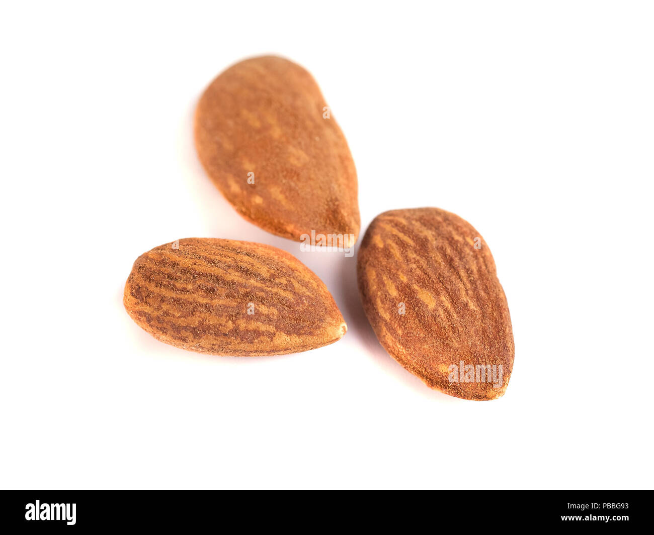 brown roast almonds on white background Stock Photo - Alamy