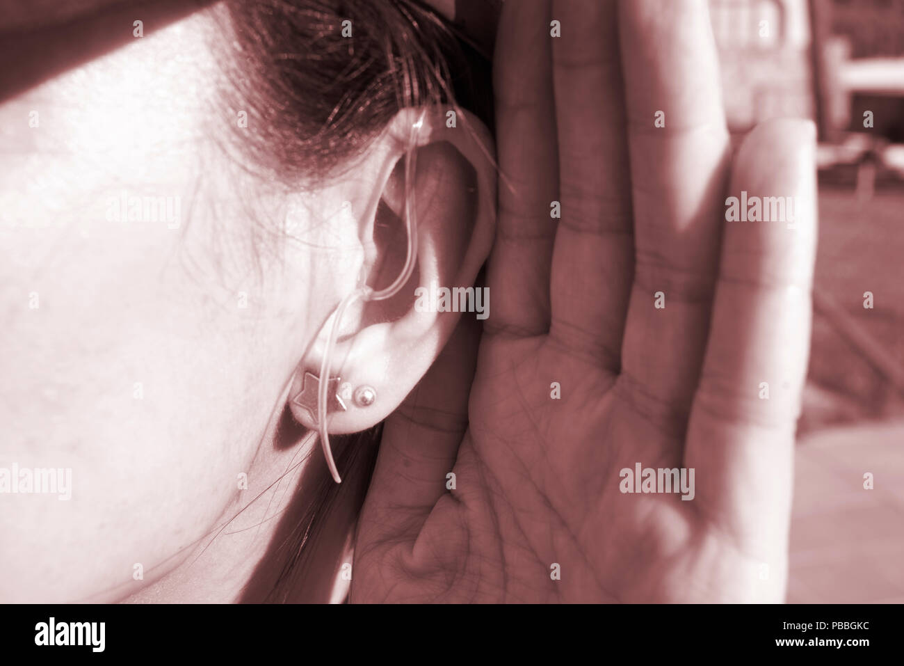 Modern compact in the ear digital audiophone hearing aid in the ear of ...