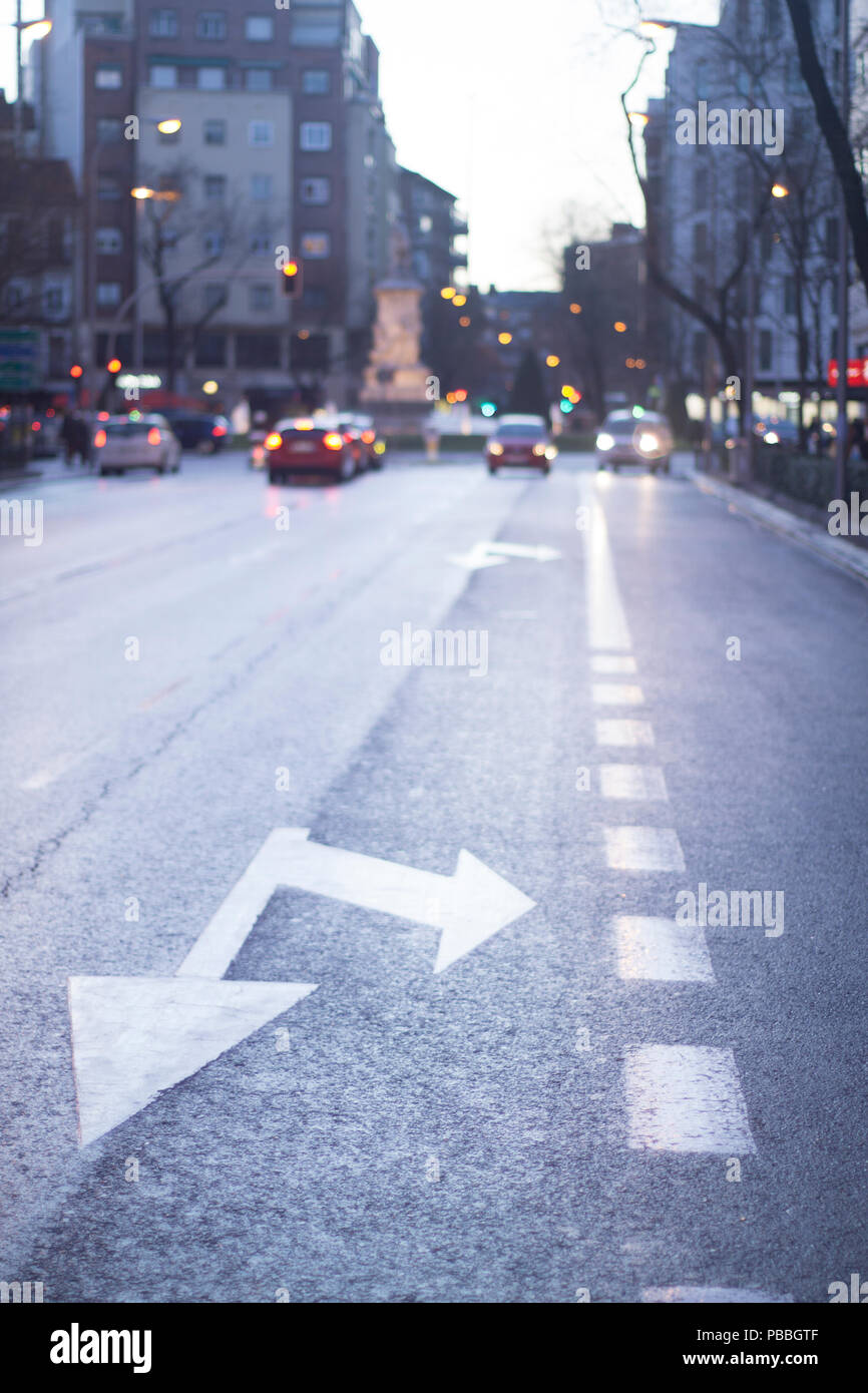 City street in Madrid Spain road traffic control markings arrows ...