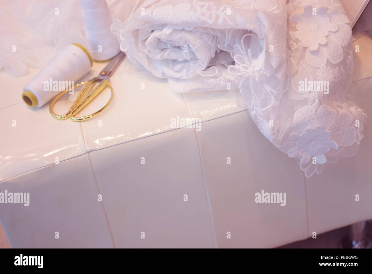 Bridal store hand made dress shop window with scissors, thread and ...