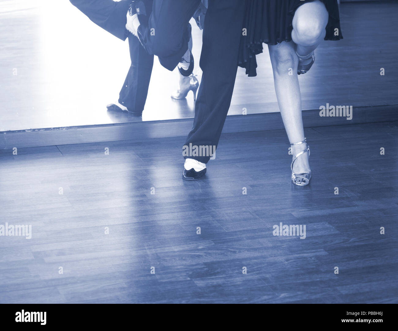 Ballroom dance couple of dancers and teachers in studio school dancing ...