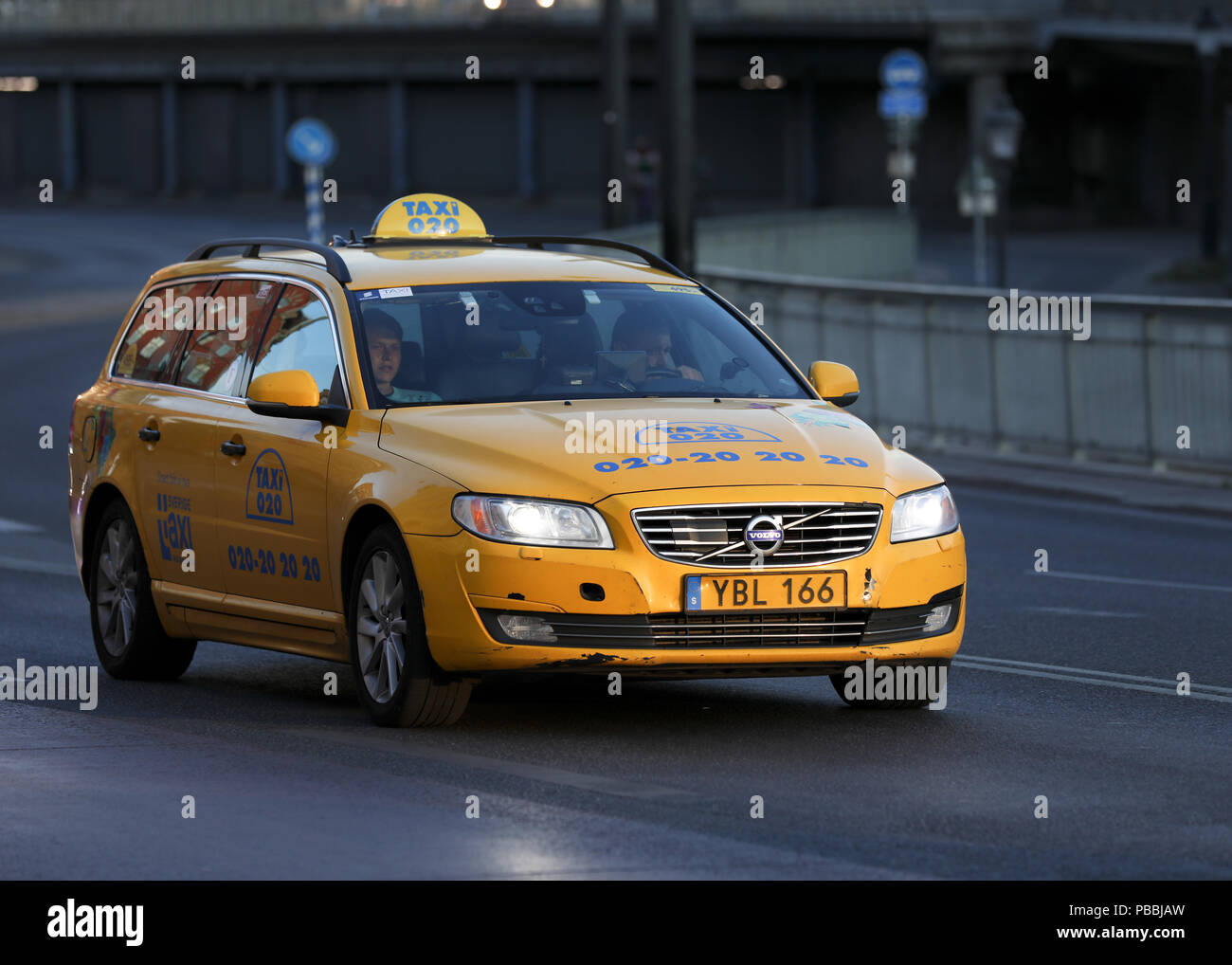 Stockholm yellow taxi Stock Photo - Alamy