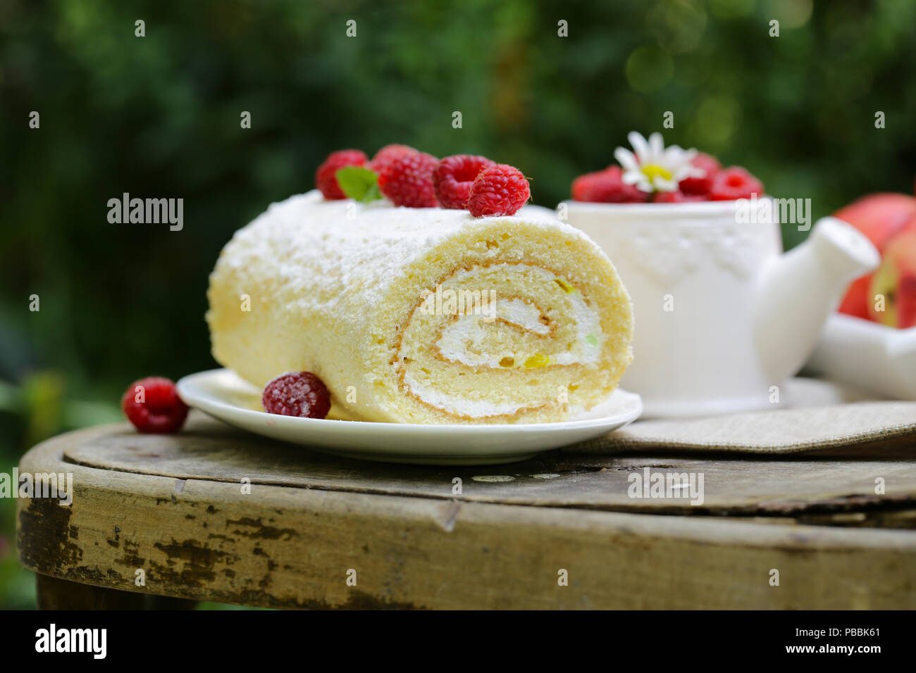 biscuit roll dessert with fresh berries, rustic style Stock Photo - Alamy