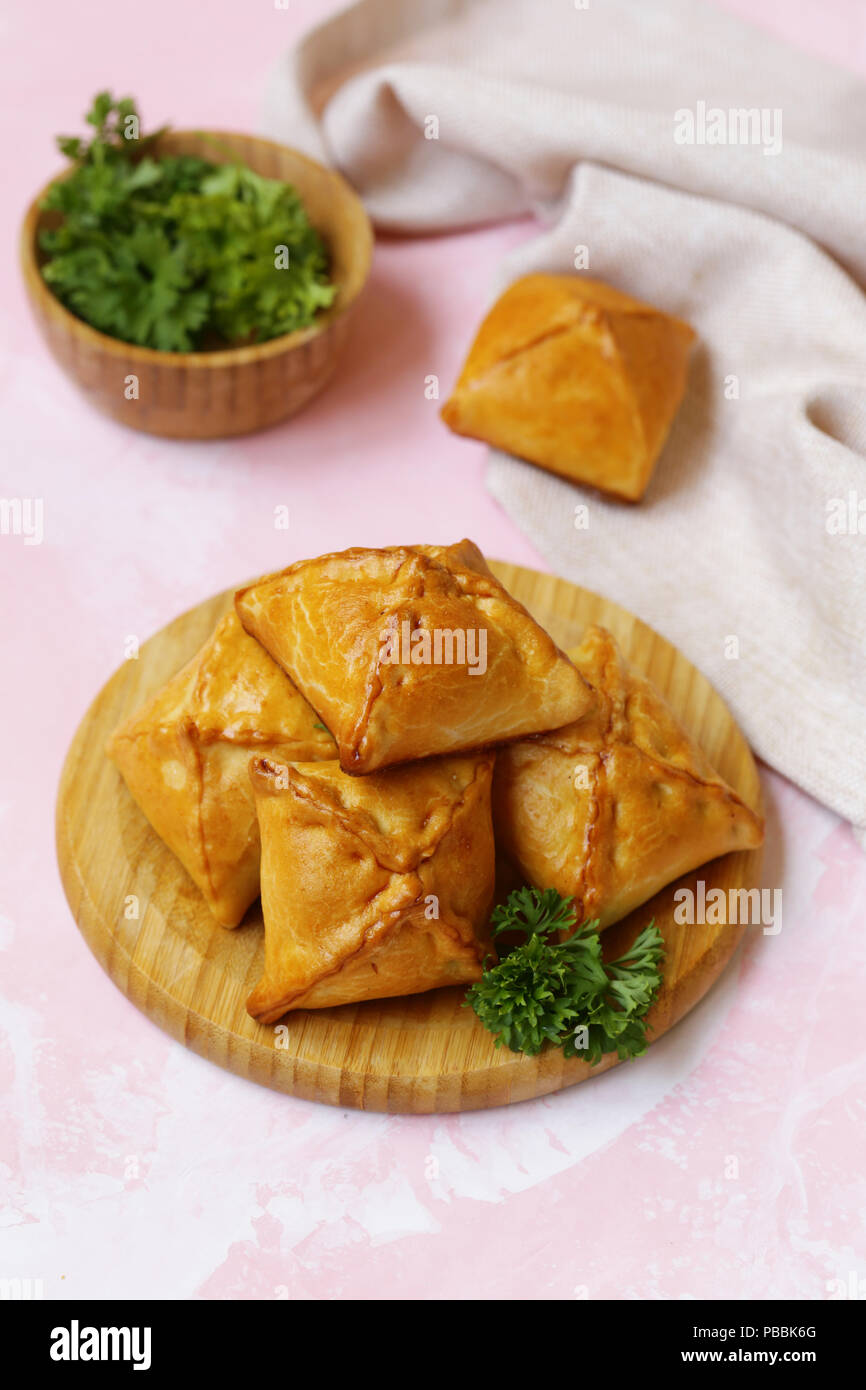 small pies with meat samsa - oriental cuisine Stock Photo - Alamy