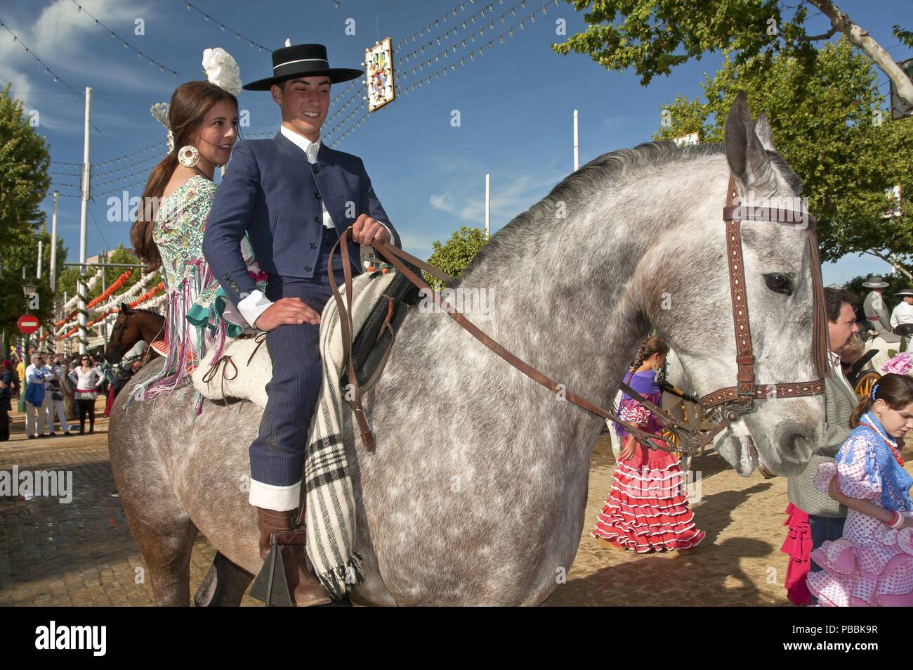 April Fair, Young couple riding on horse, Sevilla, Region of Andalusia ...